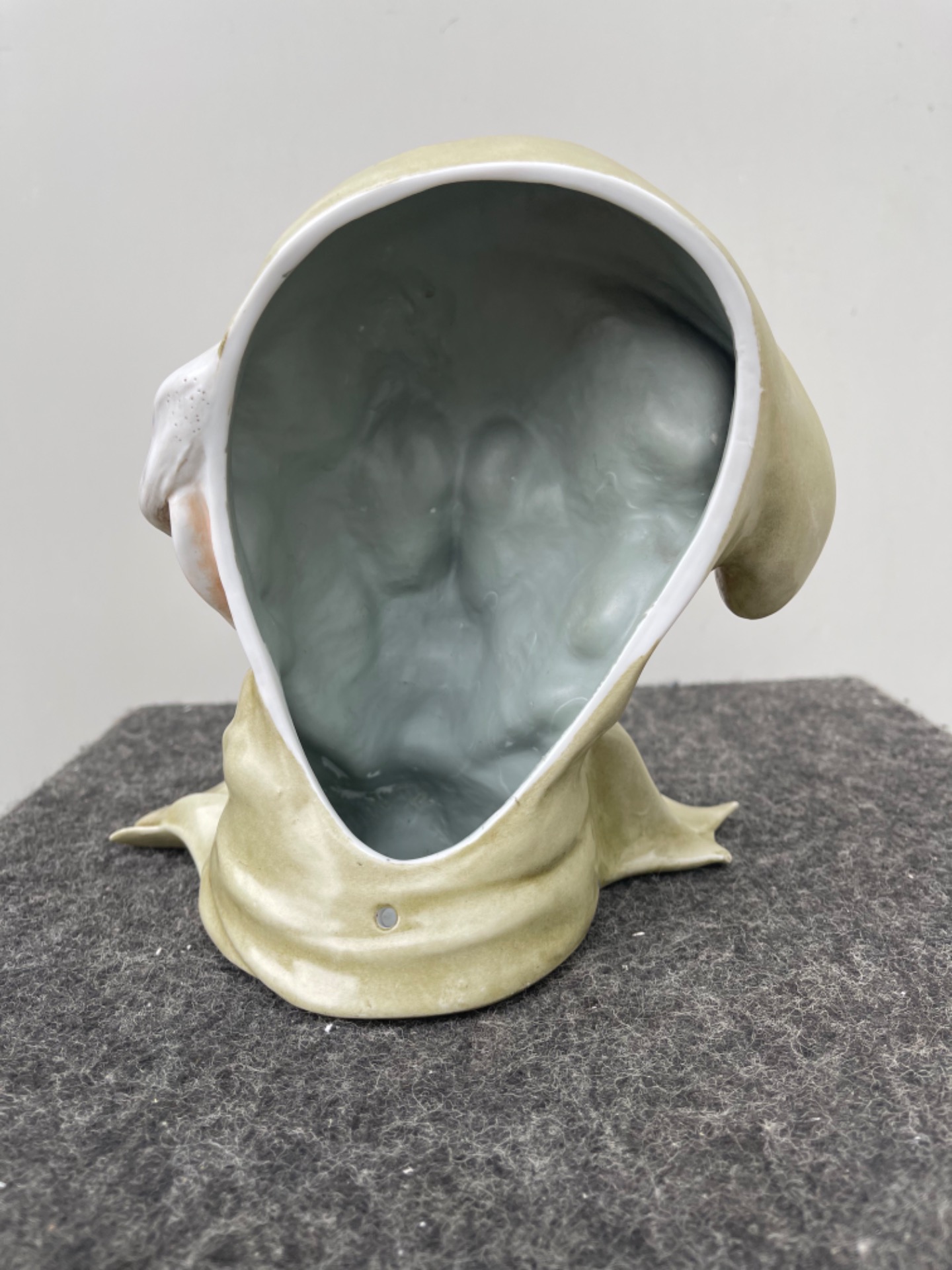 Porcelain sculpture depicting a male head with hat and pipe.Giuseppe ...